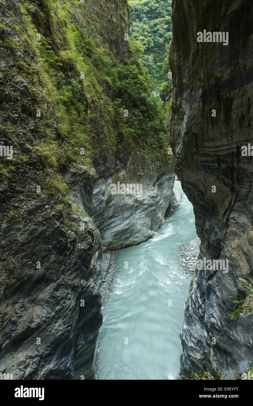 View of steep cliffs and river at the bottom of deep and narrow gorge ...