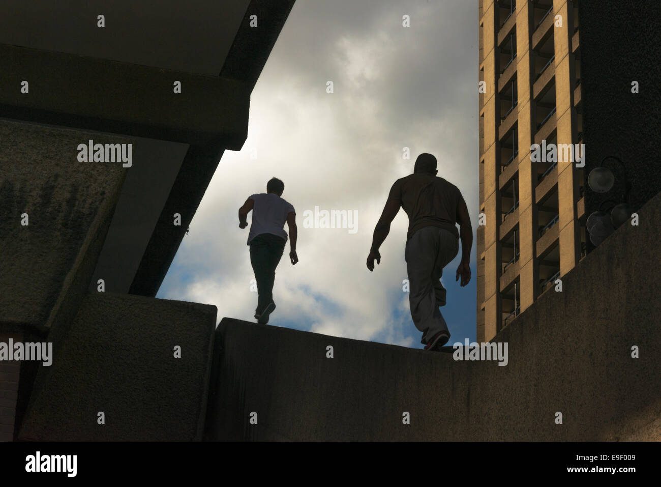 Two Parkour traceurs running Stock Photo - Alamy