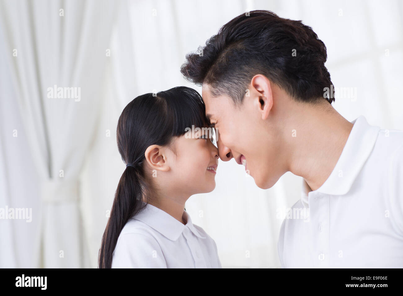 Father and daughter head to head Stock Photo - Alamy