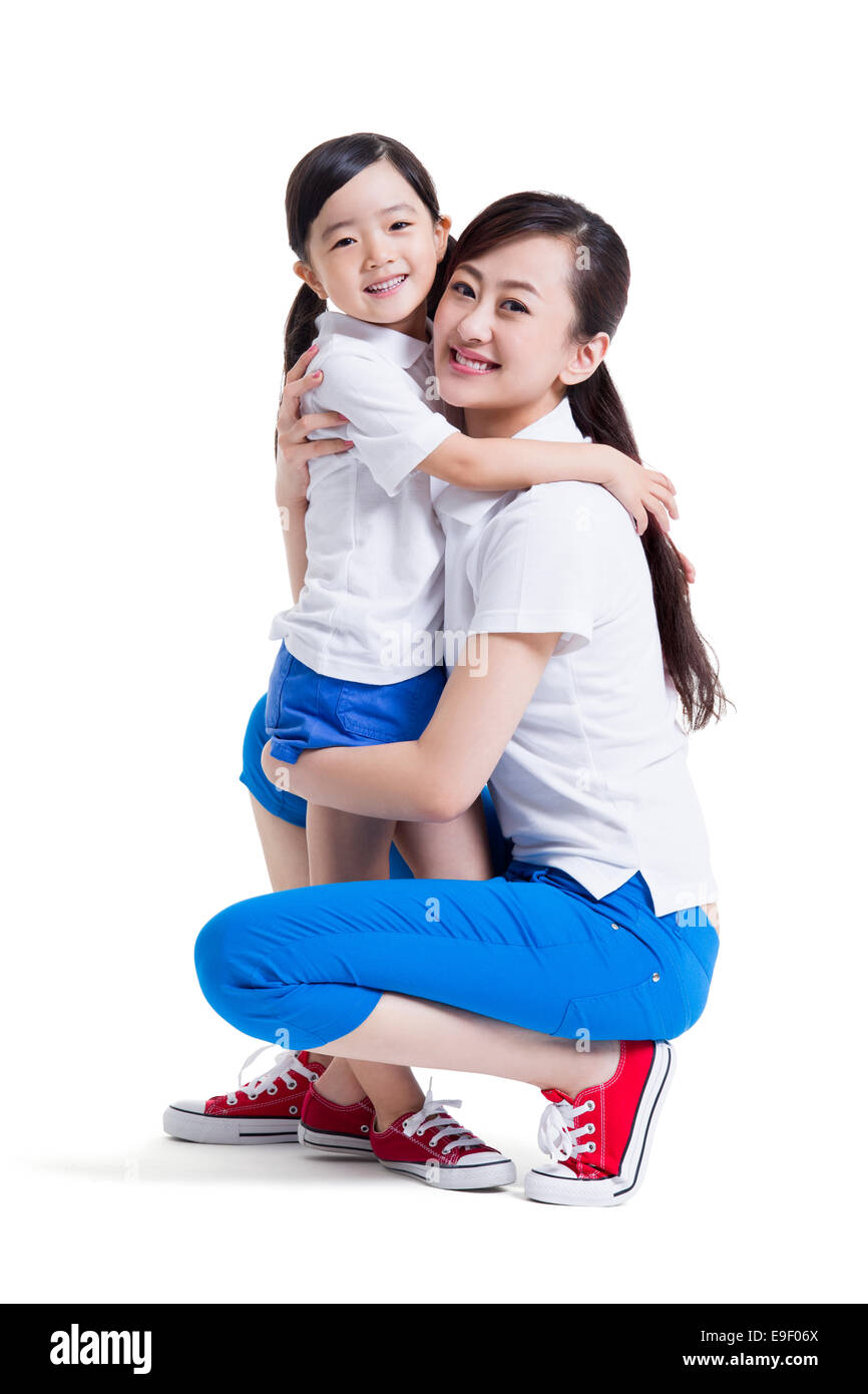 Mother and daughter embracing Stock Photo - Alamy