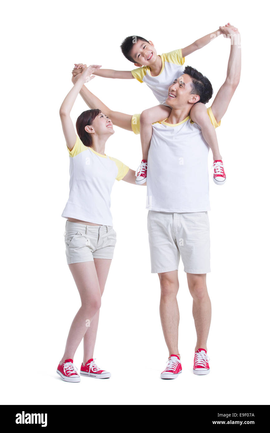 Son sitting on his father's shoulder Stock Photo - Alamy