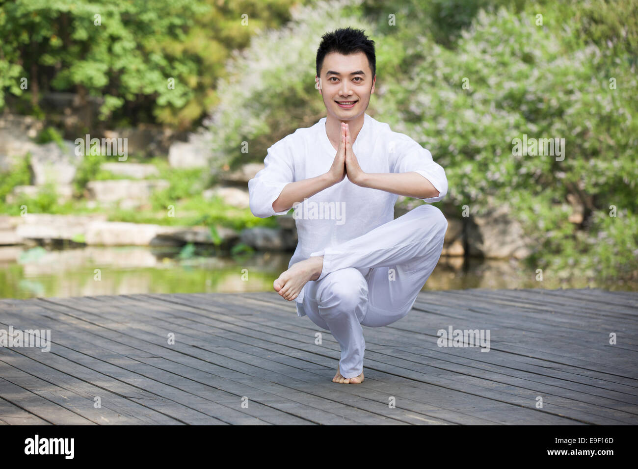 Young man practicing yoga Stock Photo - Alamy