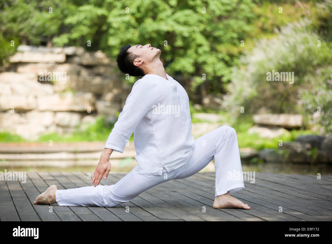 Young man practicing yoga Stock Photo - Alamy