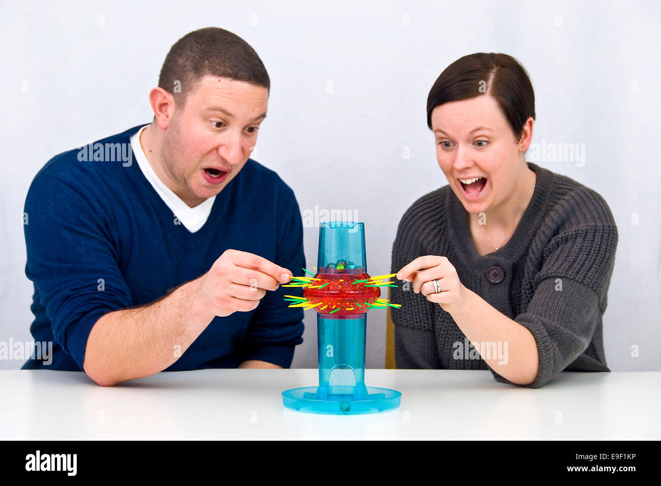 a couple play a classic kids game of kerplunk, in this funny comedy ...
