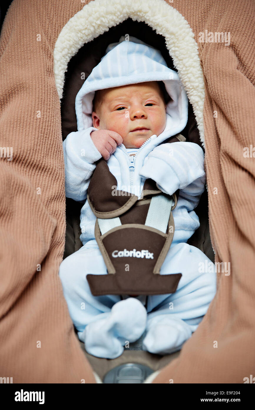 The three days old newborn baby poses in car seat in Prague, Czech ...