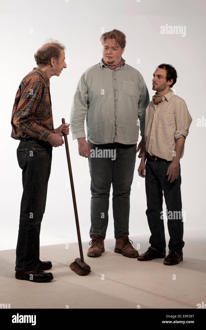 men talking, old man, little and large man, standing talking with a ...