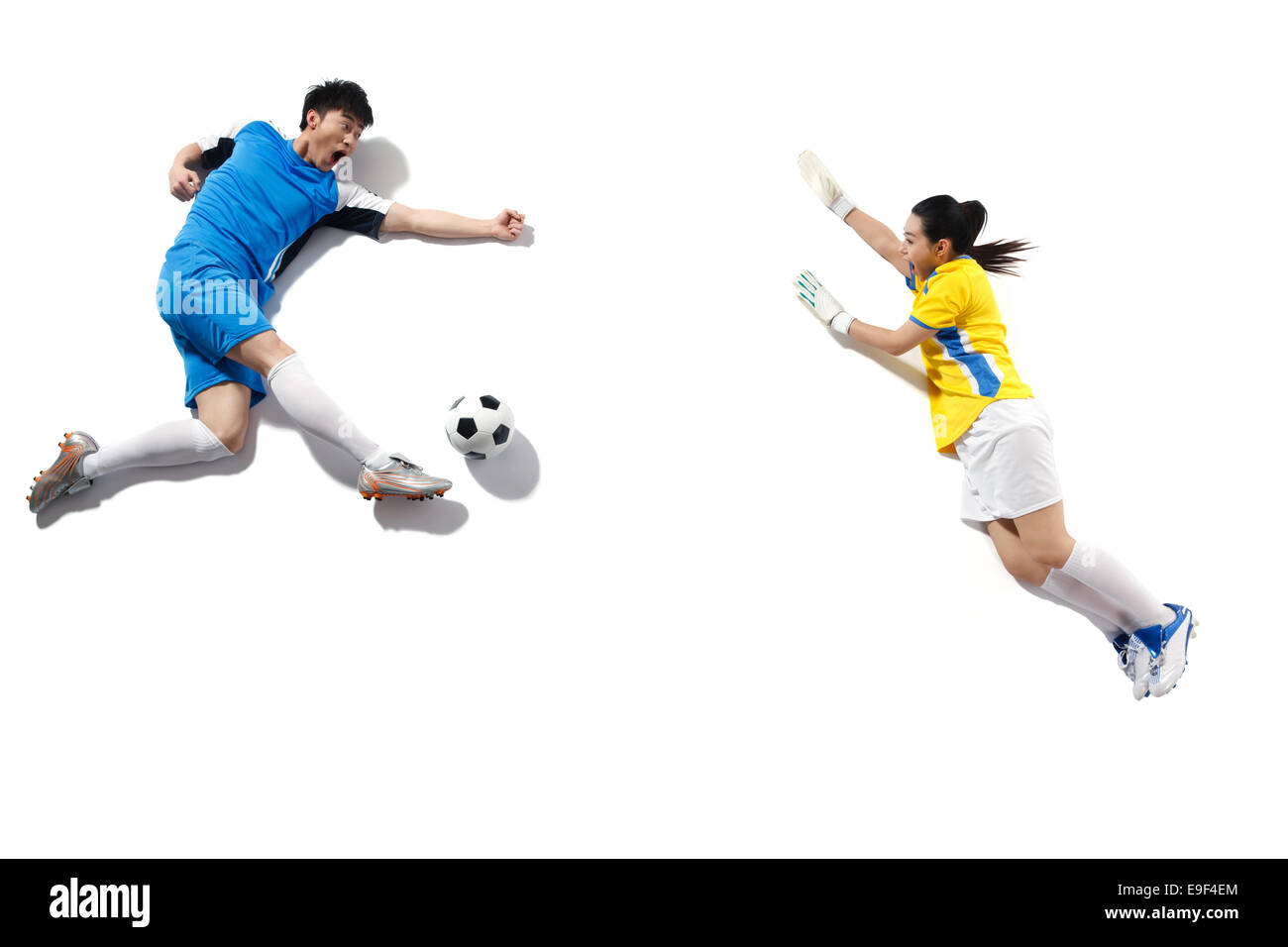 Athletes playing football Stock Photo - Alamy