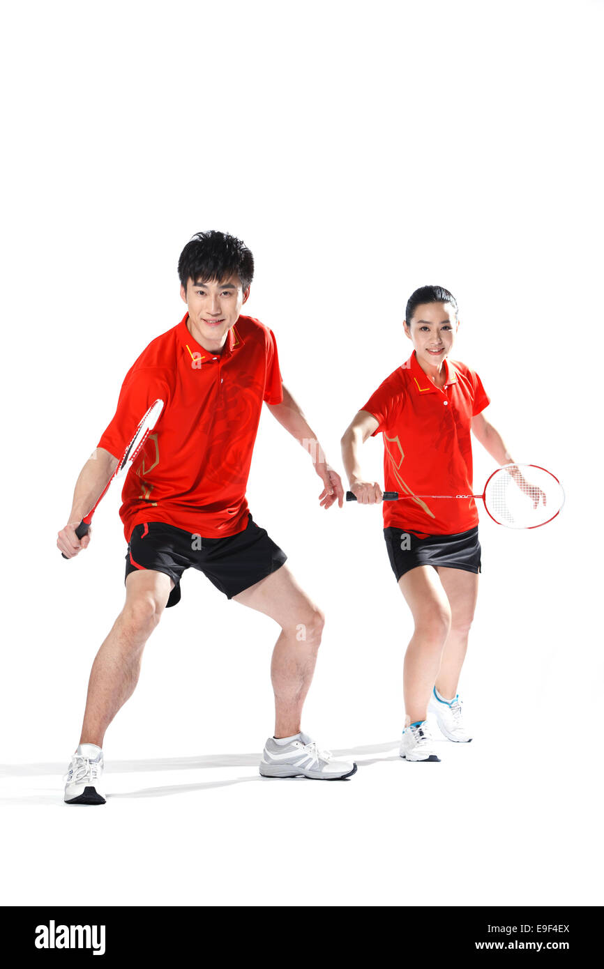 Athletes playing badminton Stock Photo - Alamy