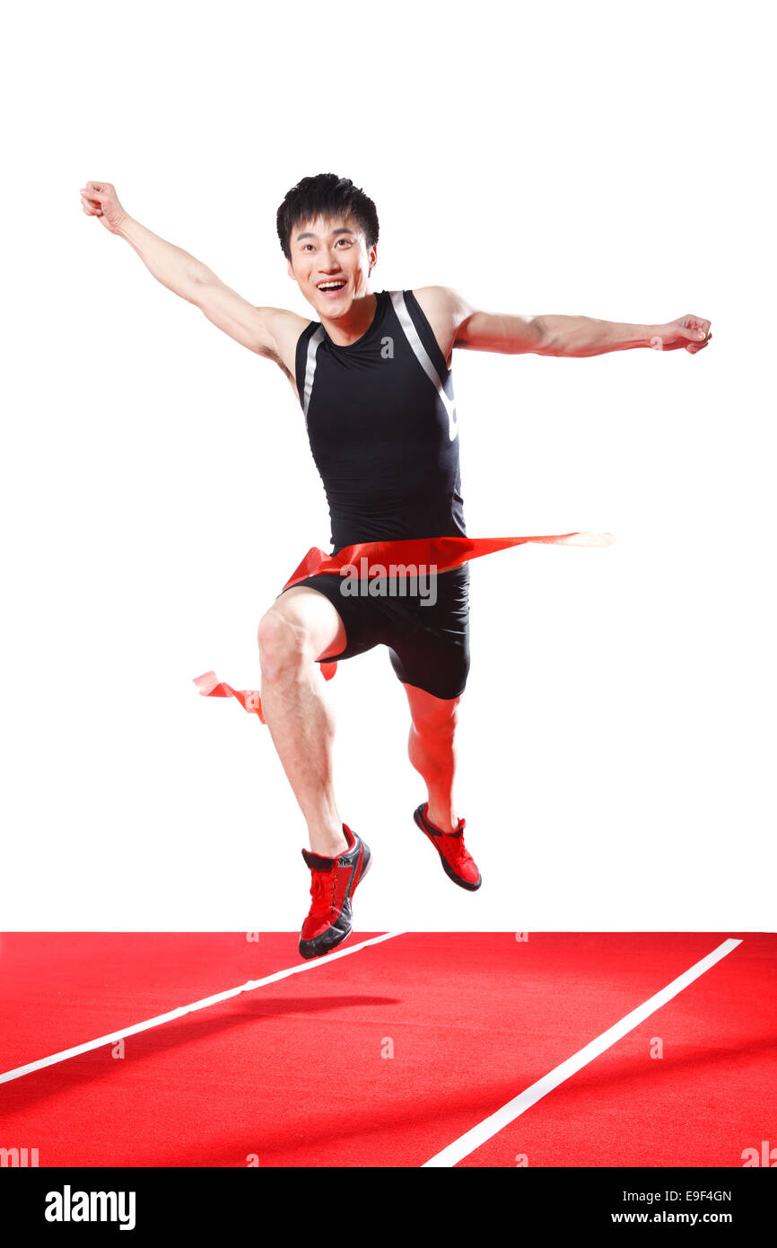Winning athlete finish line Cut Out Stock Images & Pictures - Alamy