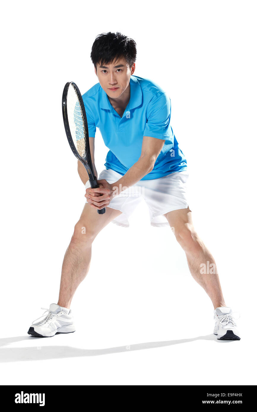 Male athletes playing tennis Stock Photo - Alamy