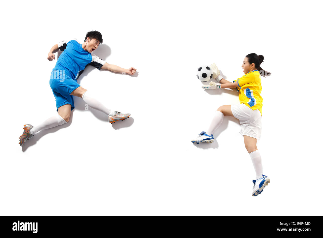 Athletes playing football Stock Photo - Alamy