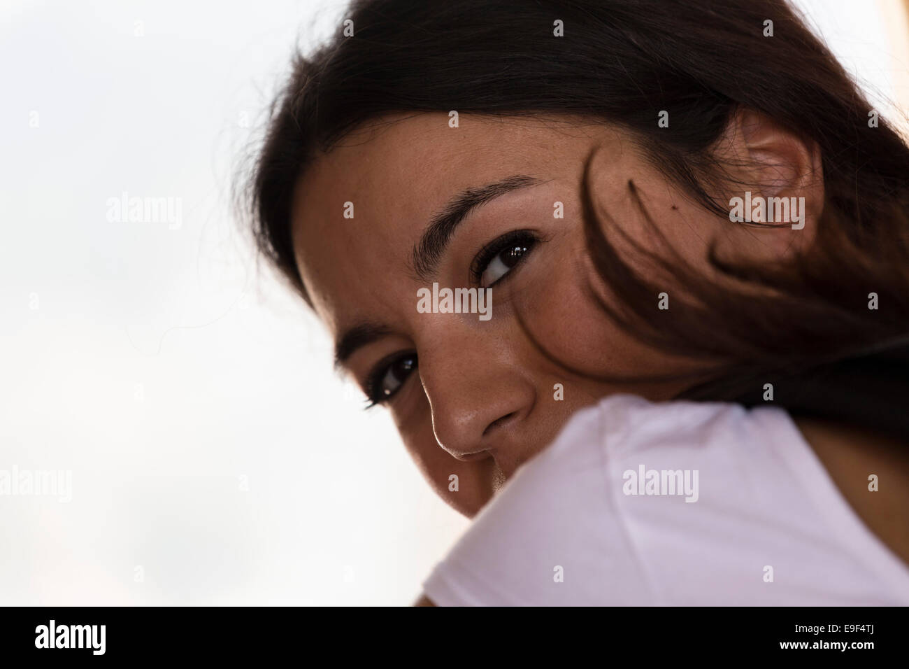 Portrait of woman with brown eyes winking Stock Photo - Alamy