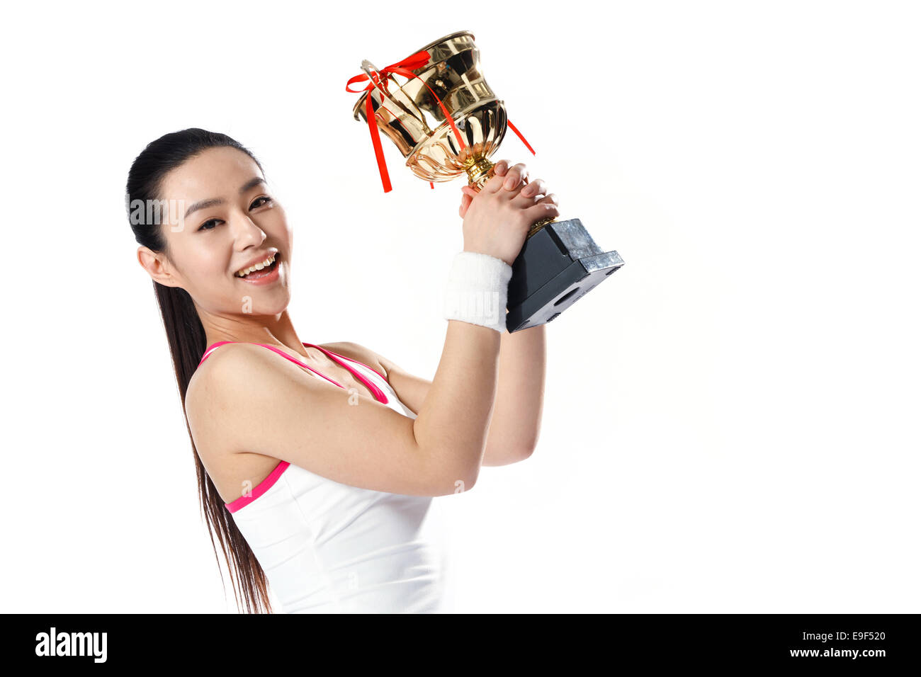 Athlete holding the trophy Stock Photo - Alamy