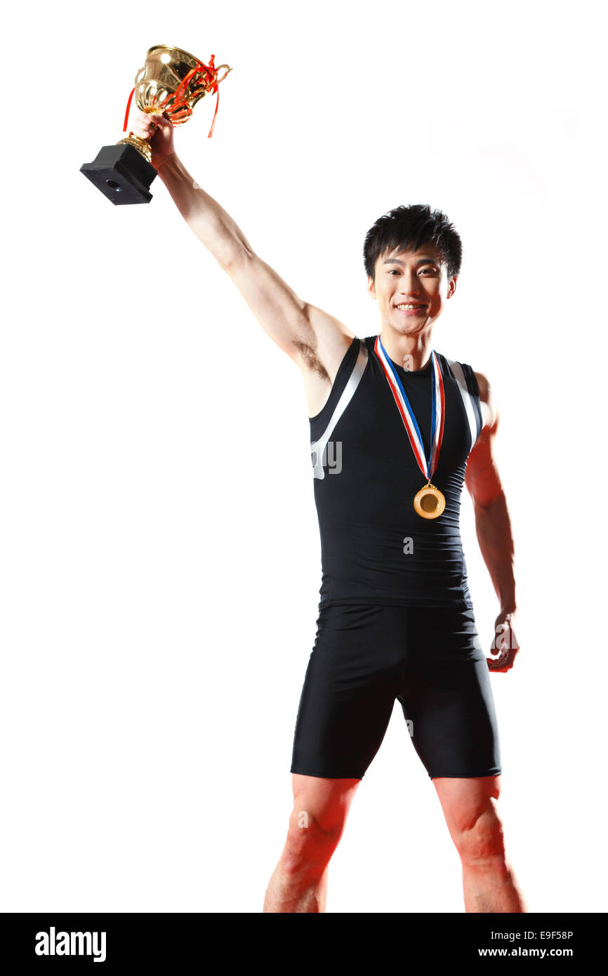 Athlete holding the trophy Stock Photo - Alamy