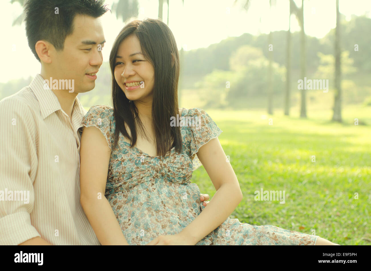 chinese young couple on green grassland Stock Photo - Alamy