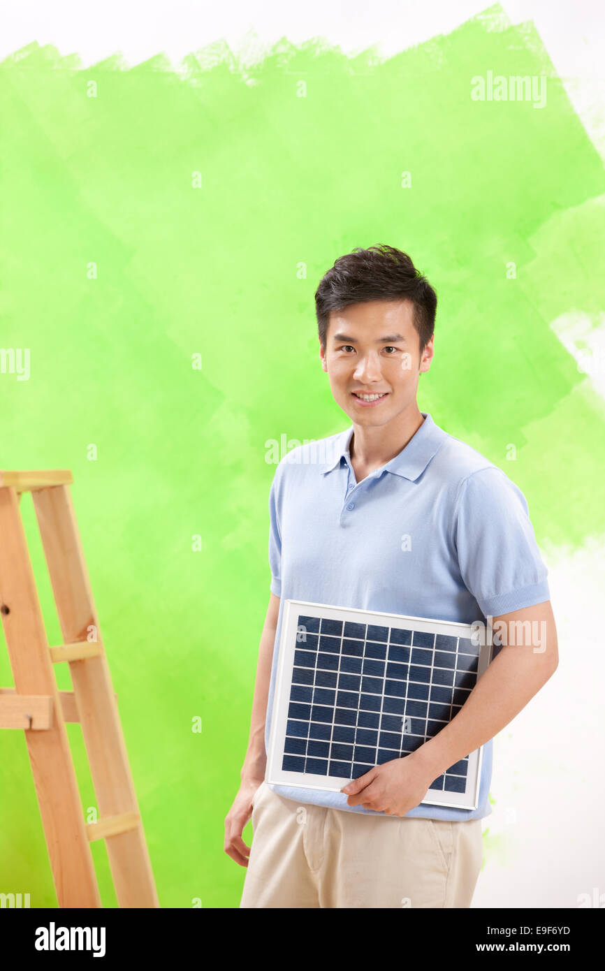 Alternative energy man holding hi-res stock photography and images - Alamy