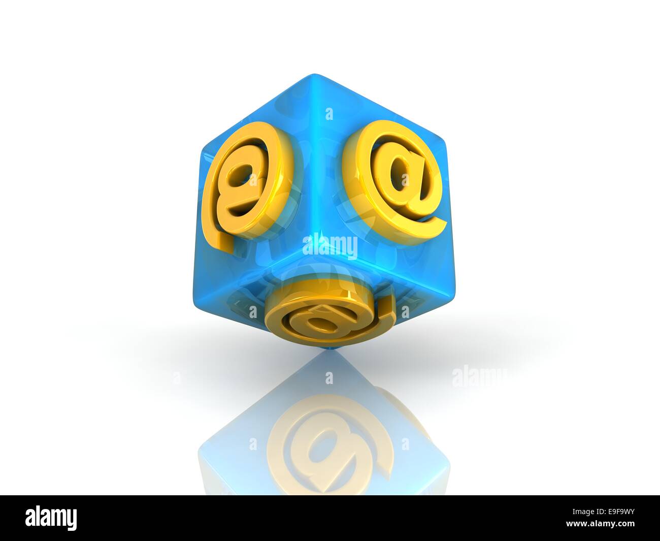 gold at symbol on reflective blue cube isolated with white background ...