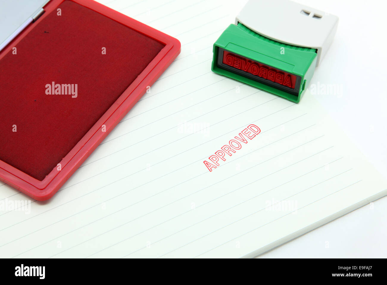 approved stamp on paper with rubber stamp Stock Photo - Alamy