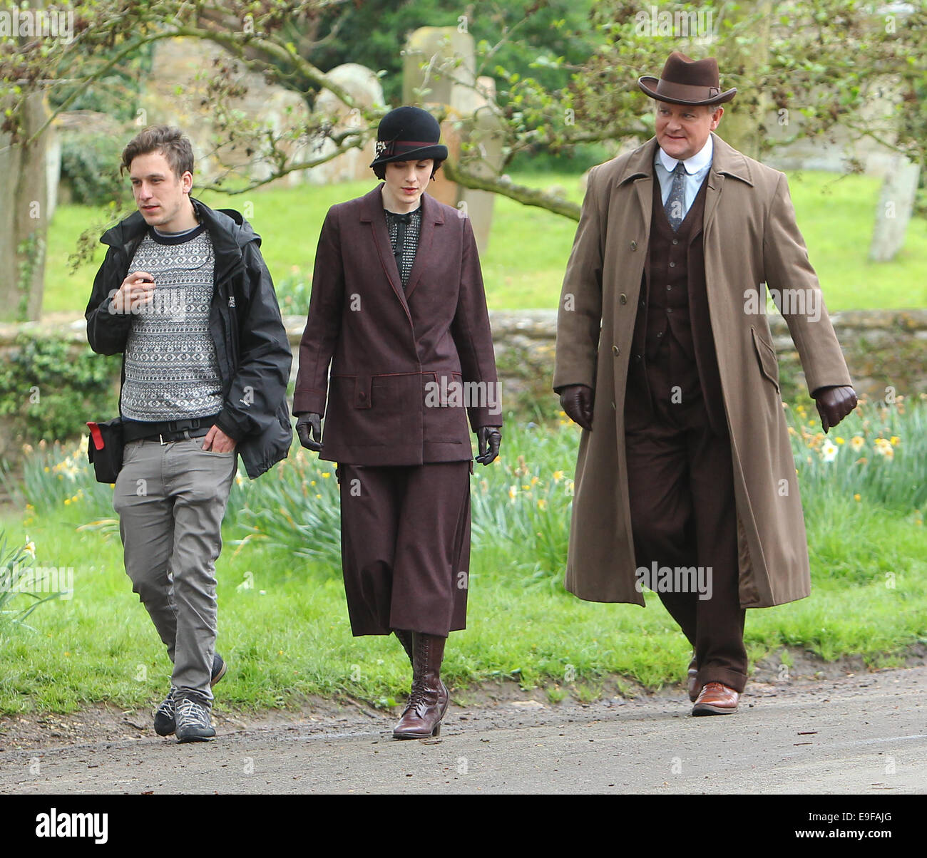 The cast of Downton Abbey film scenes on location outside a churchyard ...
