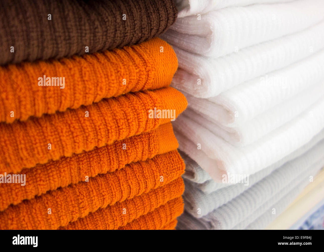 Stacks of towels on store shelf Stock Photo - Alamy