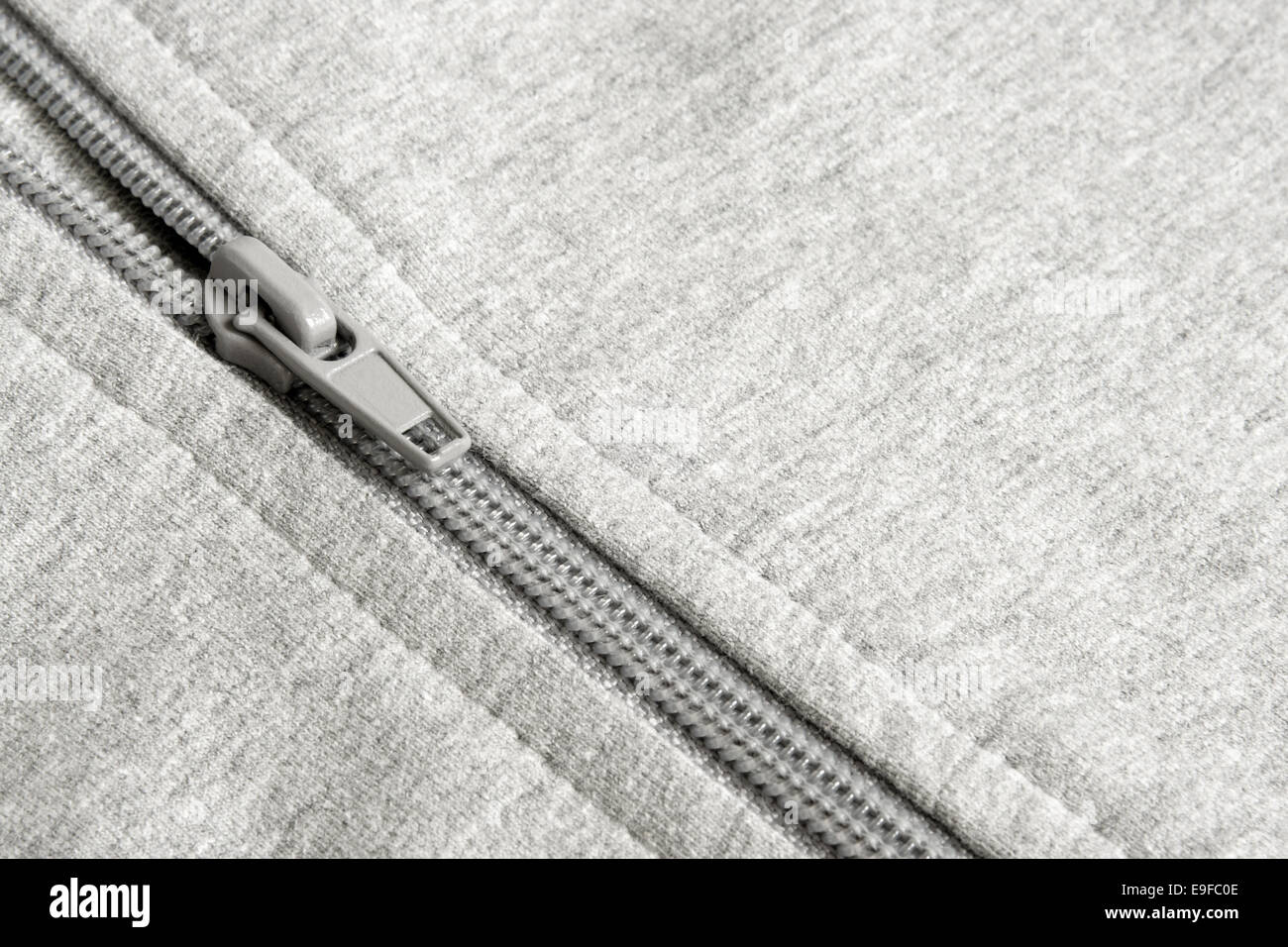 Closeup of zipper in gray cloth Stock Photo - Alamy