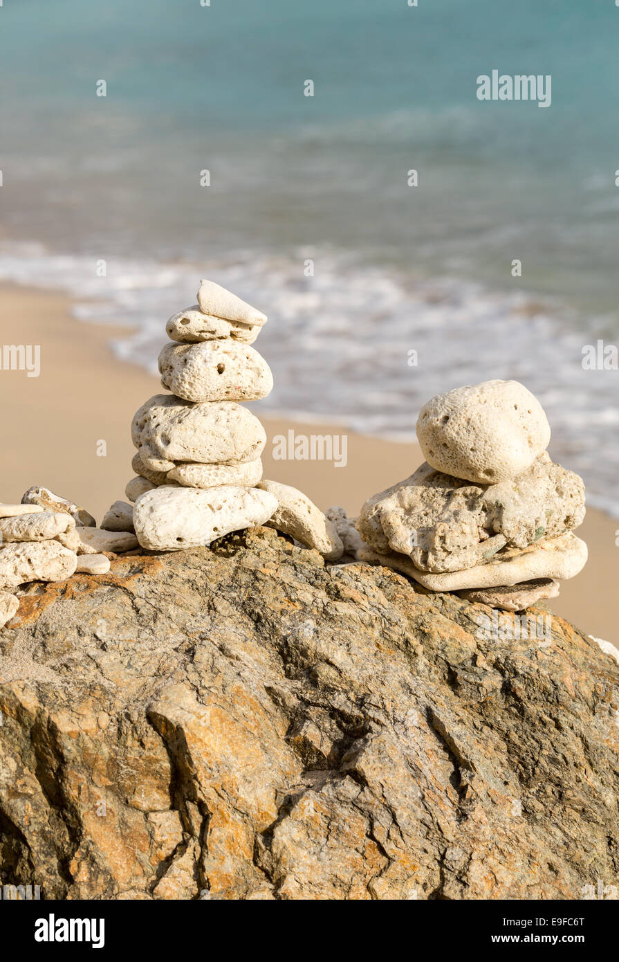 Stack of pebbles by ocean seaside Stock Photo - Alamy
