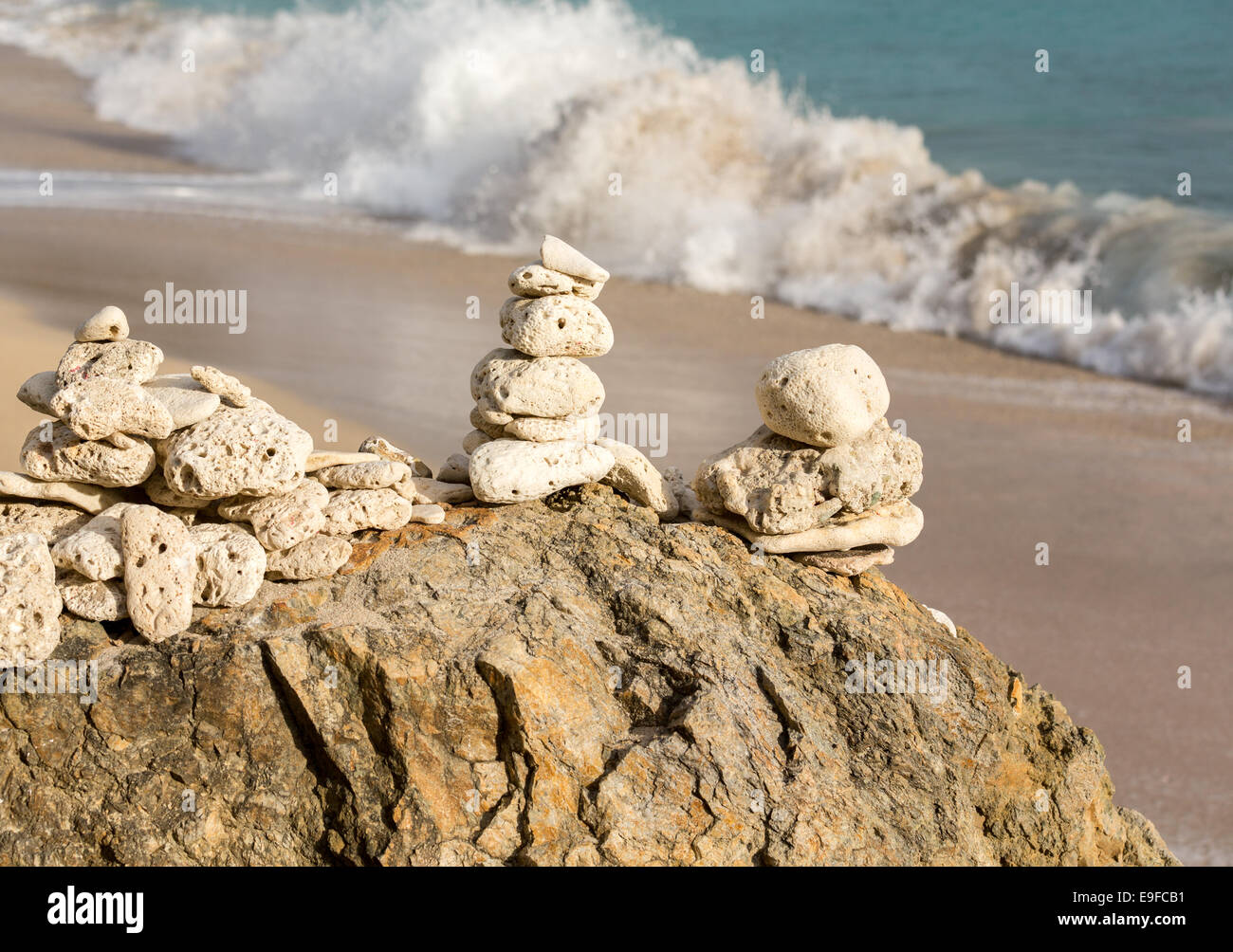 Stack of pebbles by ocean seaside Stock Photo - Alamy