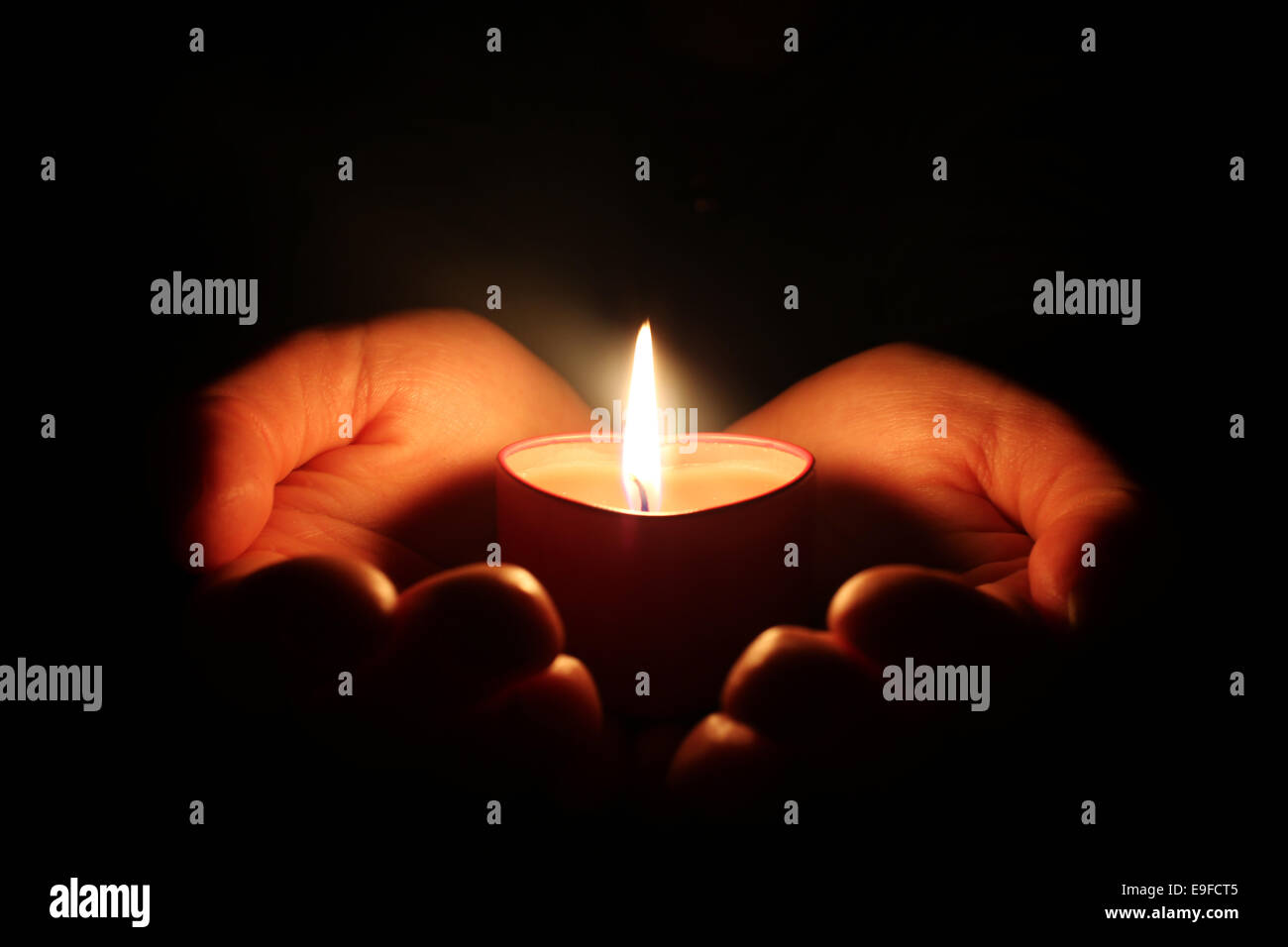 Burning candle in hand hi-res stock photography and images - Alamy