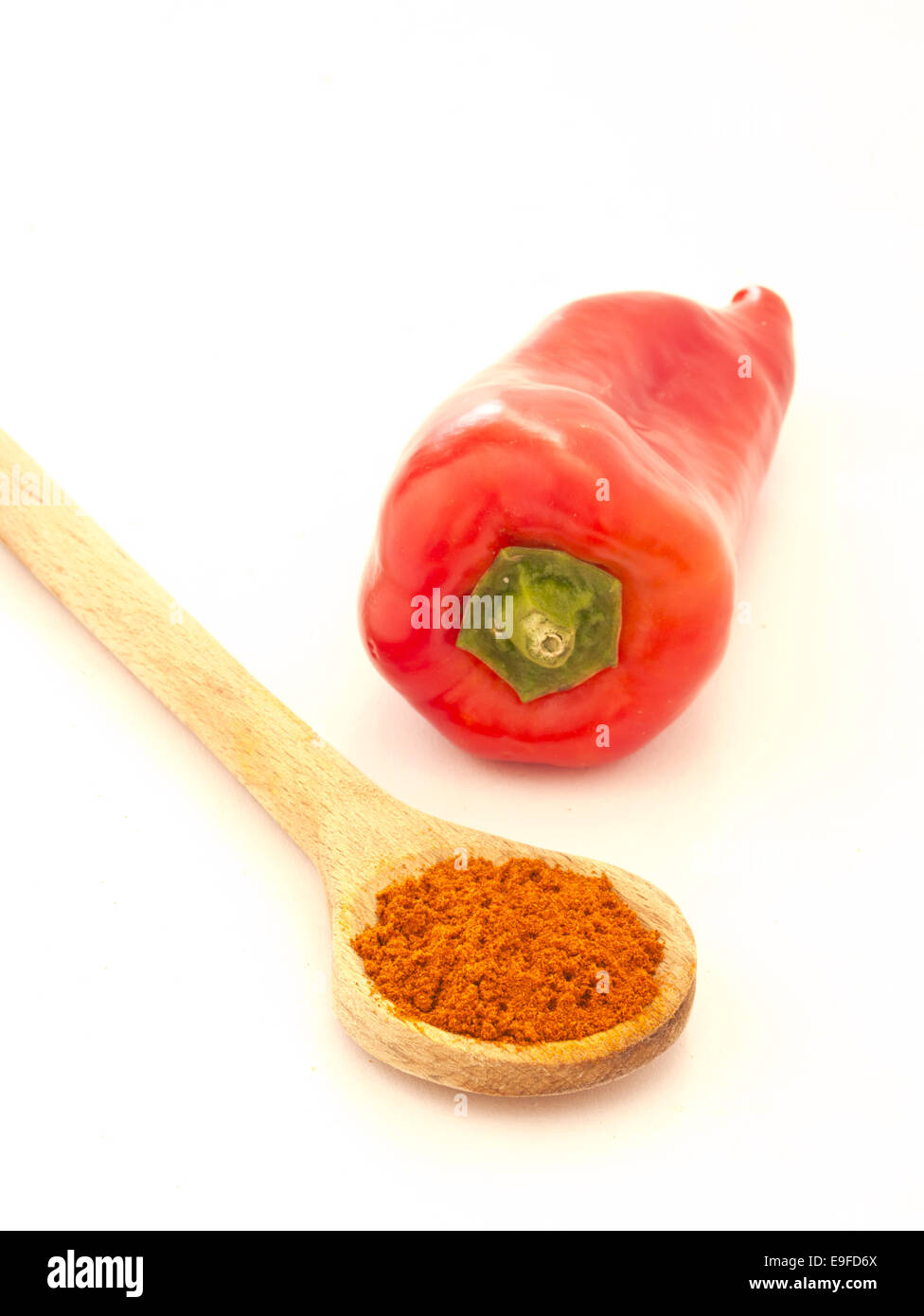 Peppers powder on a wood spoon Stock Photo - Alamy