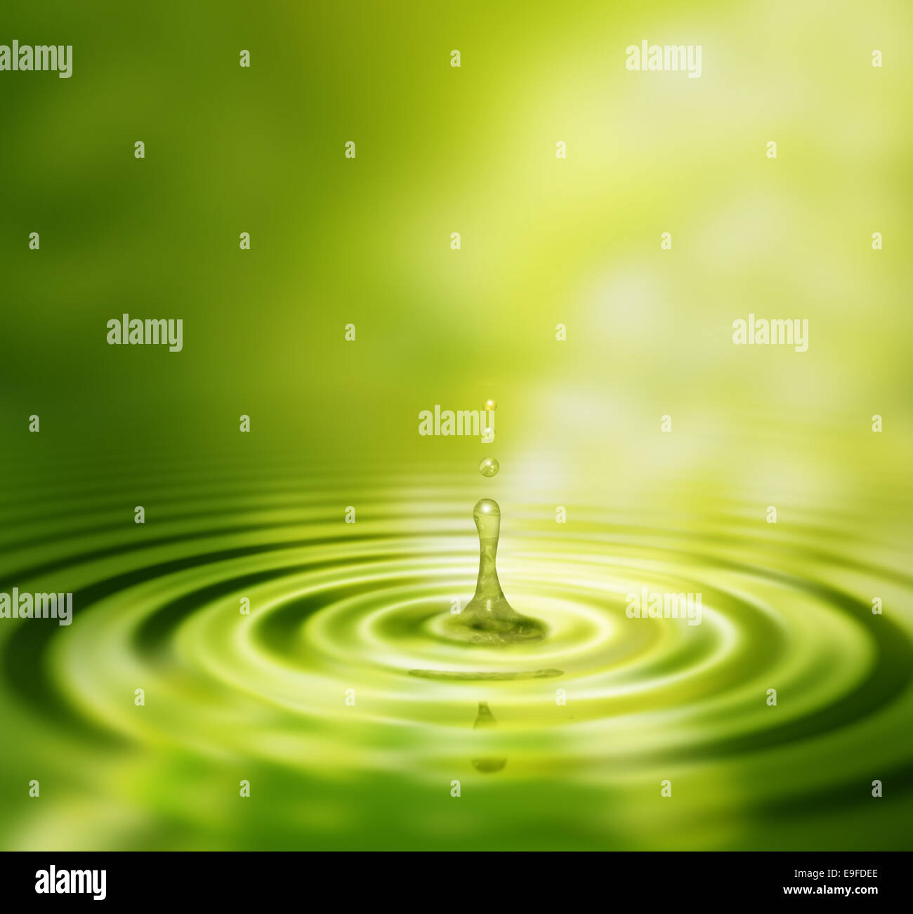 Splash of water droplet and waves Stock Photo - Alamy