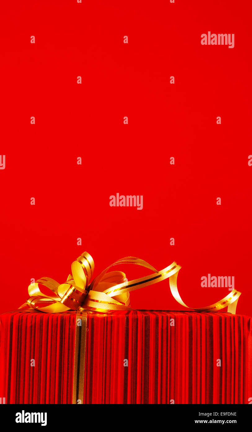 Wrapped red present box Stock Photo - Alamy