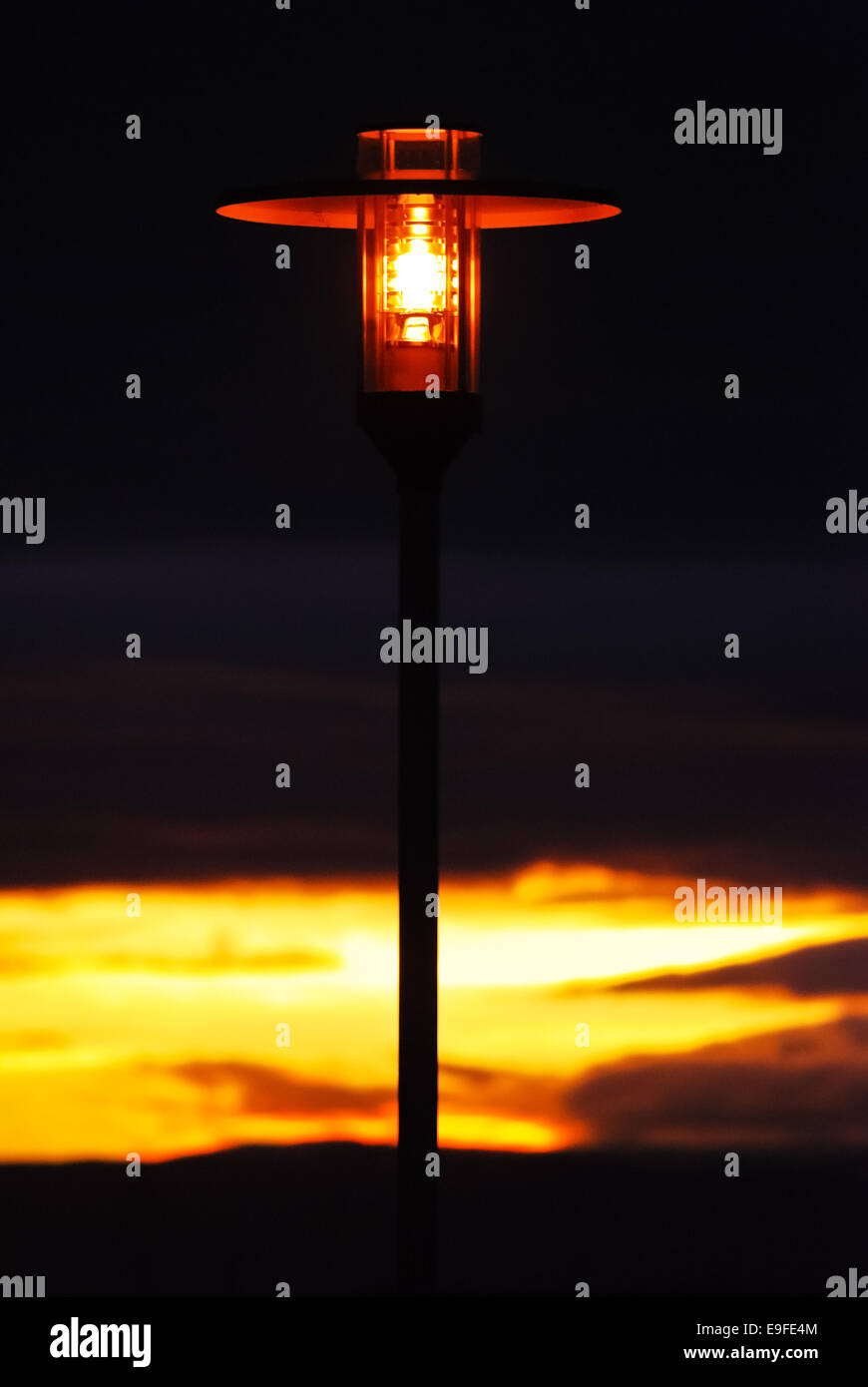 Street lamp is lit Stock Photo - Alamy
