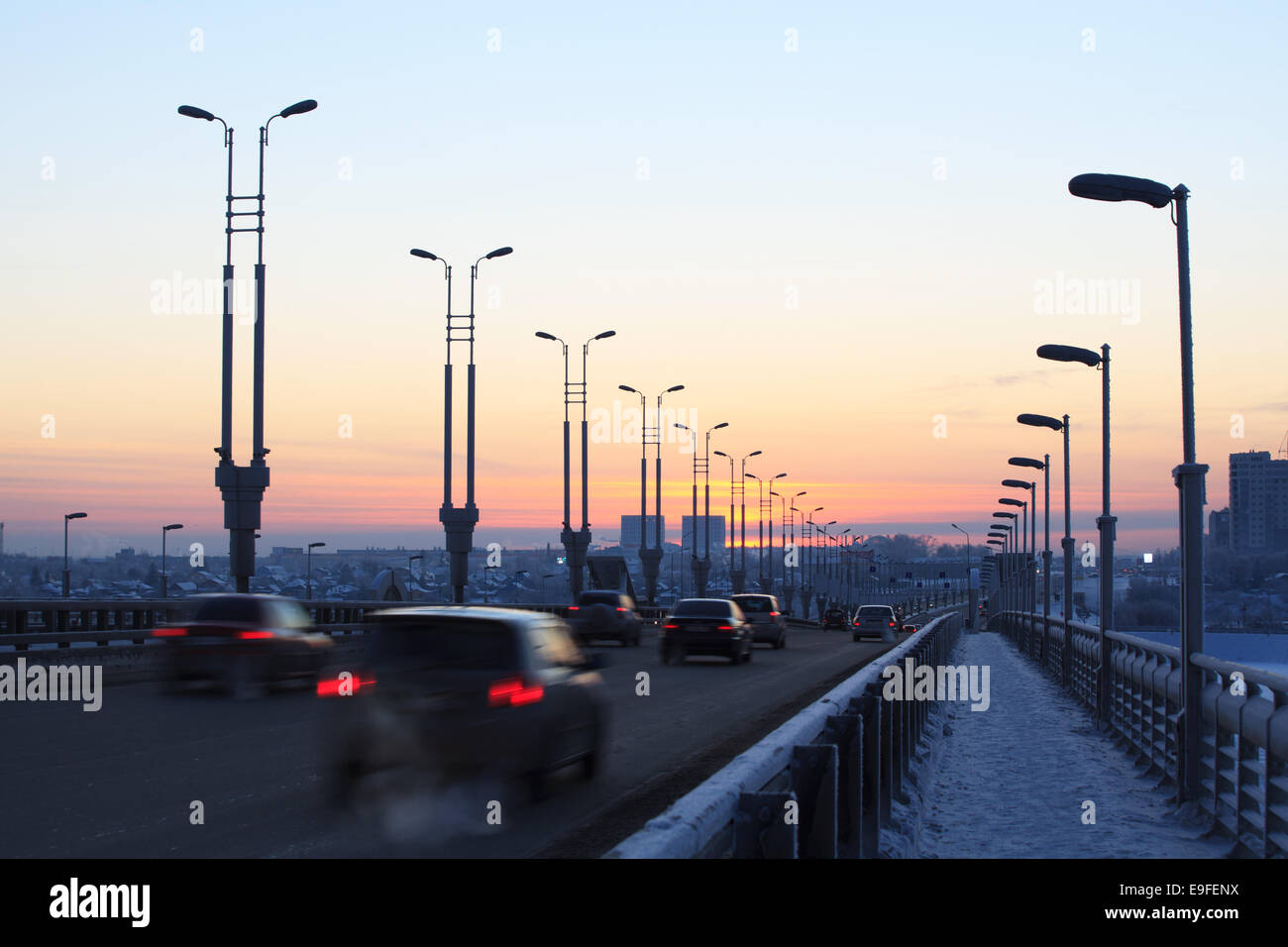 Cars on the bridge at sunset. Omsk. Russia Stock Photo - Alamy