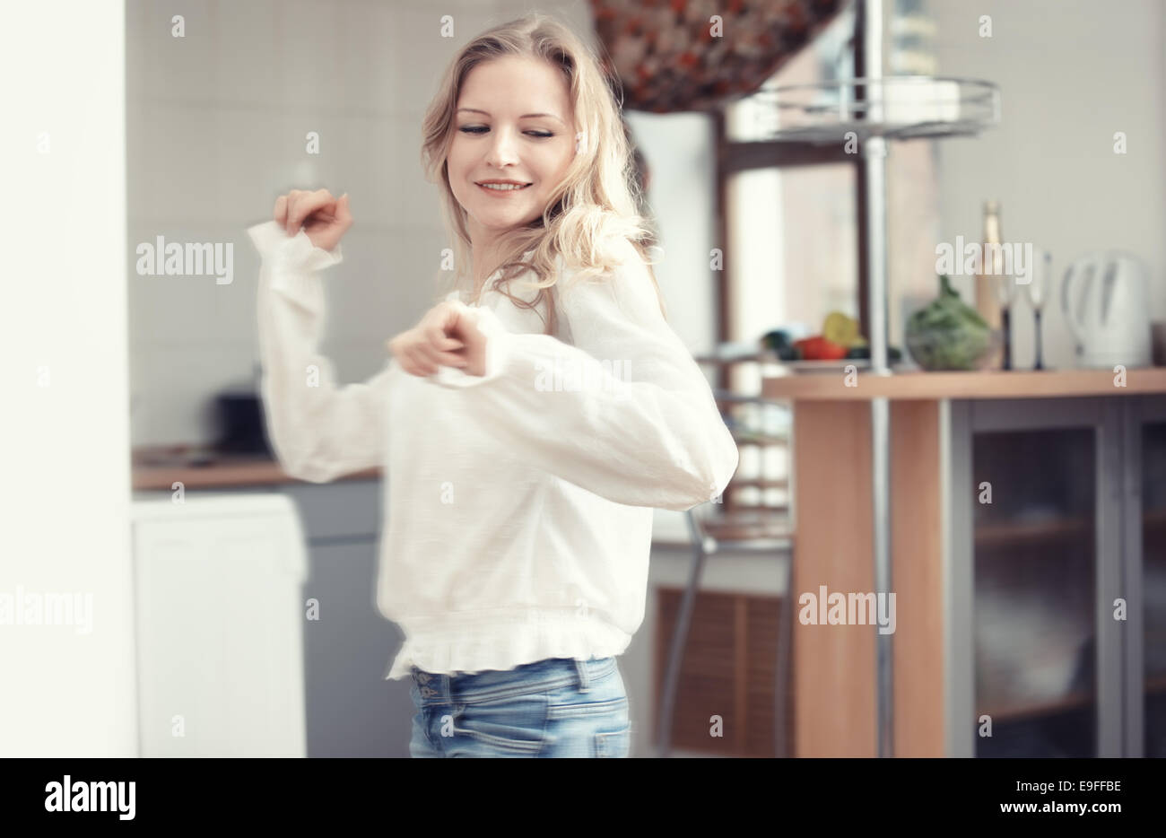 Dancing at the kitchen Stock Photo - Alamy