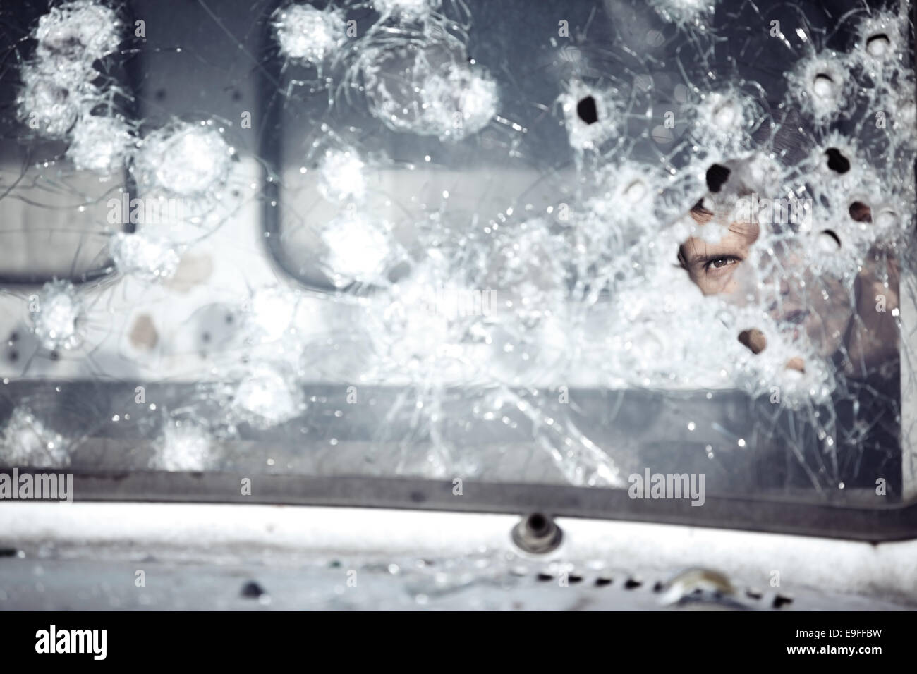 Man behind broken glass hi-res stock photography and images - Alamy