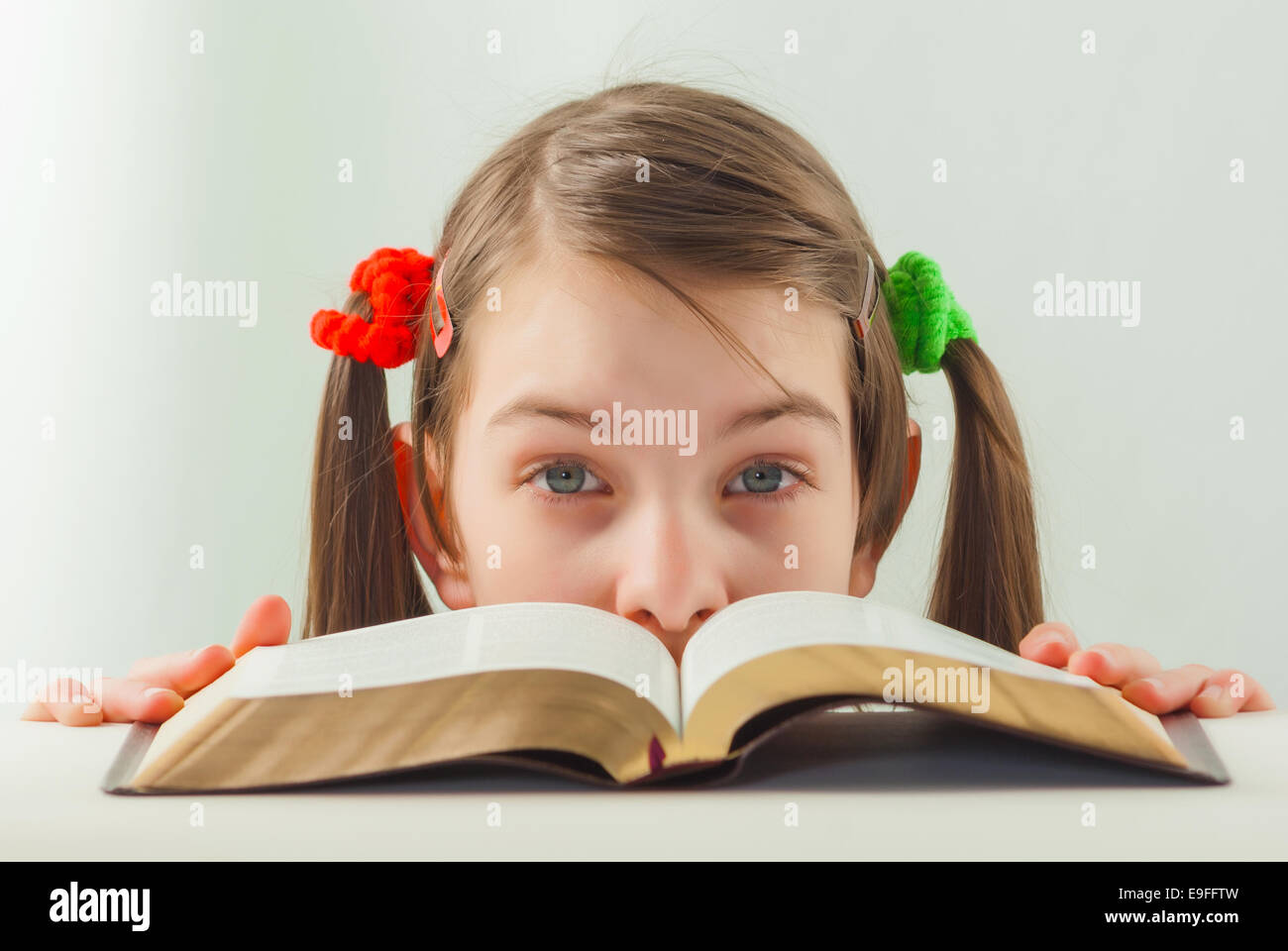 Surprised teen girl with the Bible Stock Photo - Alamy