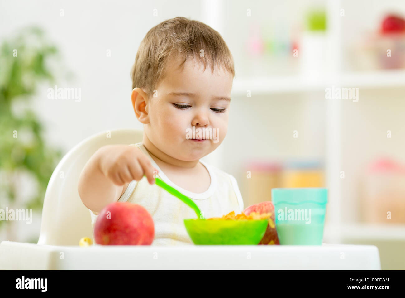 kid eating healthy food on kitchen Stock Photo - Alamy