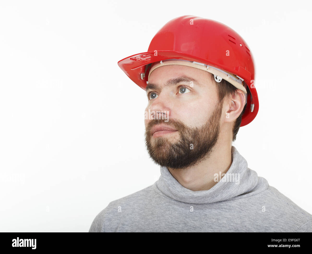 Construction worker in a red helmet Stock Photo - Alamy