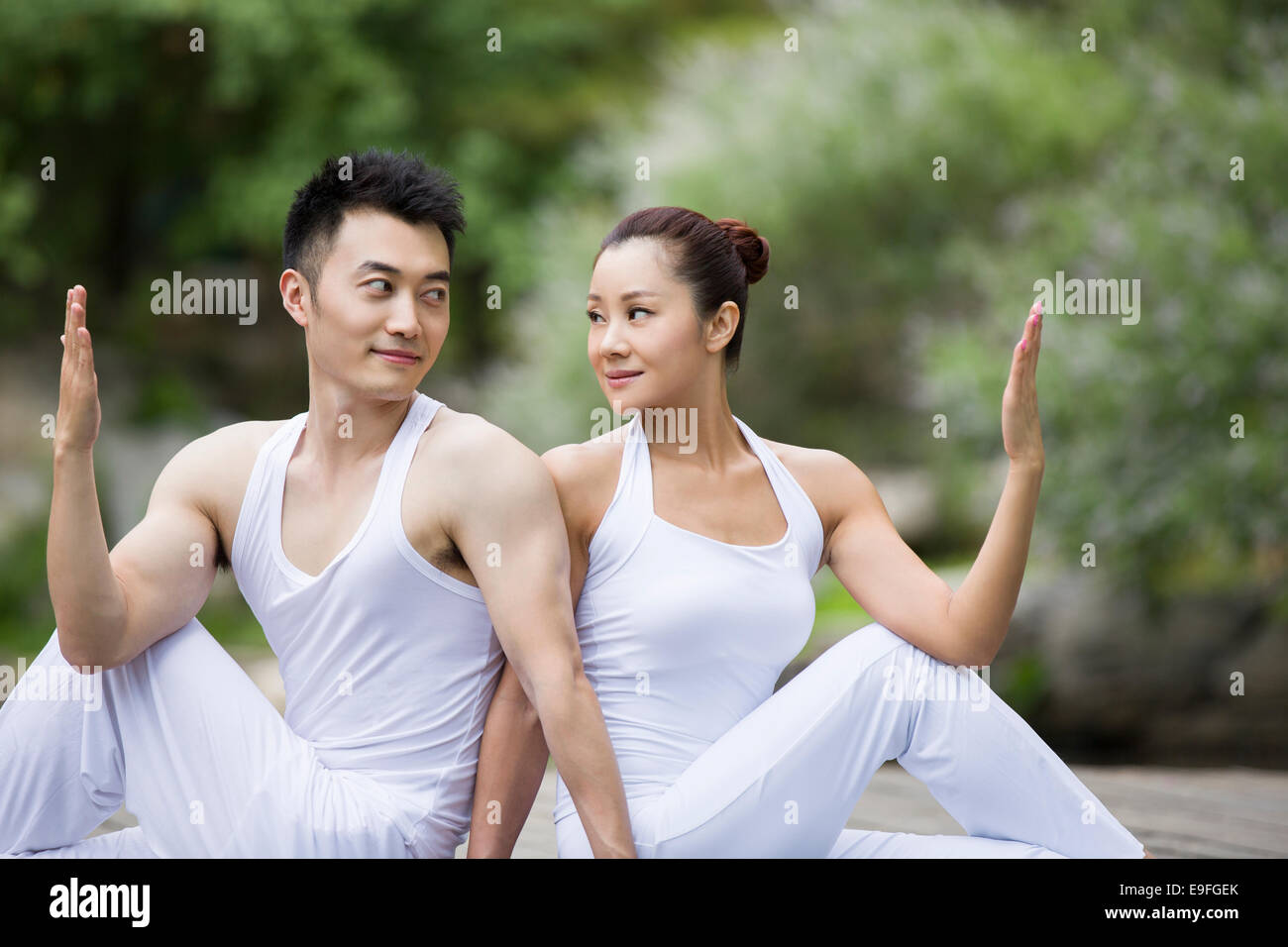 Young couple doing yoga Stock Photo - Alamy Young couple doing yoga Stock Photo - Alamy