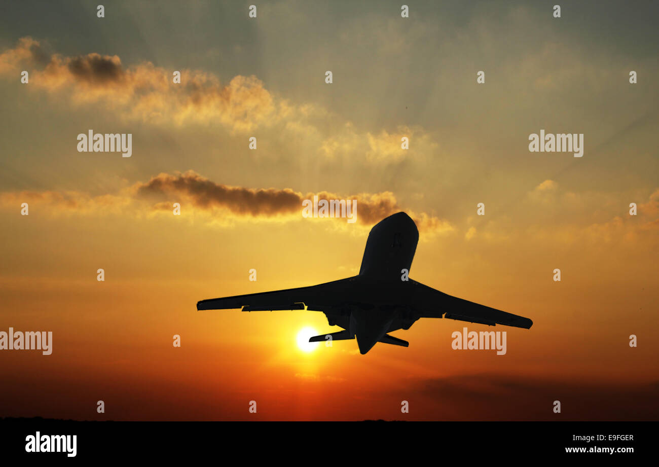 airplane taking off in sunset Stock Photo - Alamy