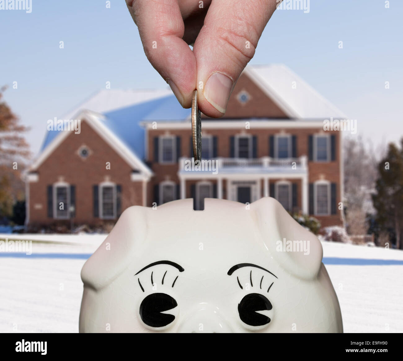 Inserting coin in piggy bank hi-res stock photography and images - Alamy