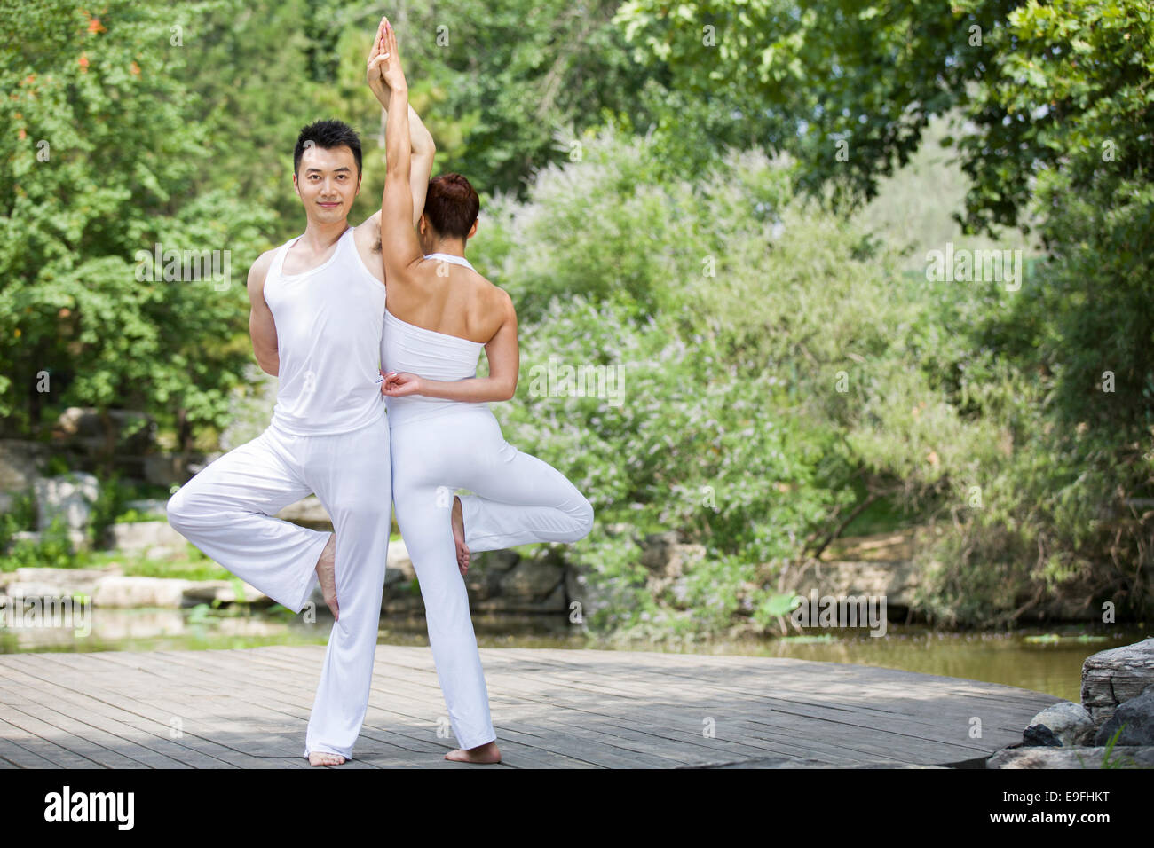 Young couple doing yoga Stock Photo - Alamy Young couple doing yoga Stock Photo - Alamy