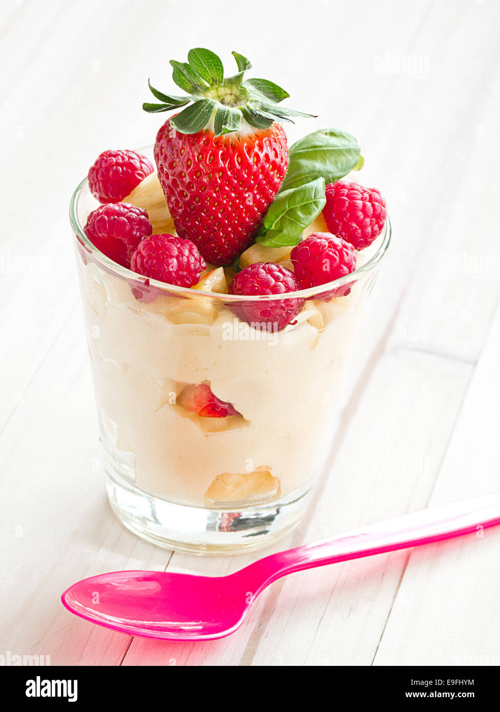 Custard dish with fresh raspberries Stock Photo - Alamy