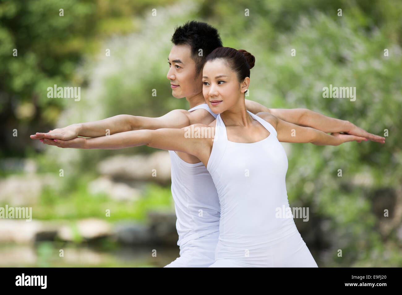 Young couple doing yoga Stock Photo - Alamy Young couple doing yoga Stock Photo - Alamy