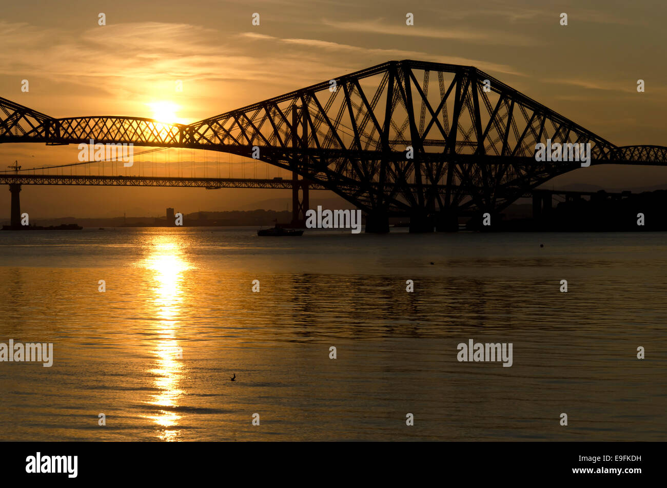 The Forth (railway) Bridge at sunset with the Forth Road Bridge behind ...