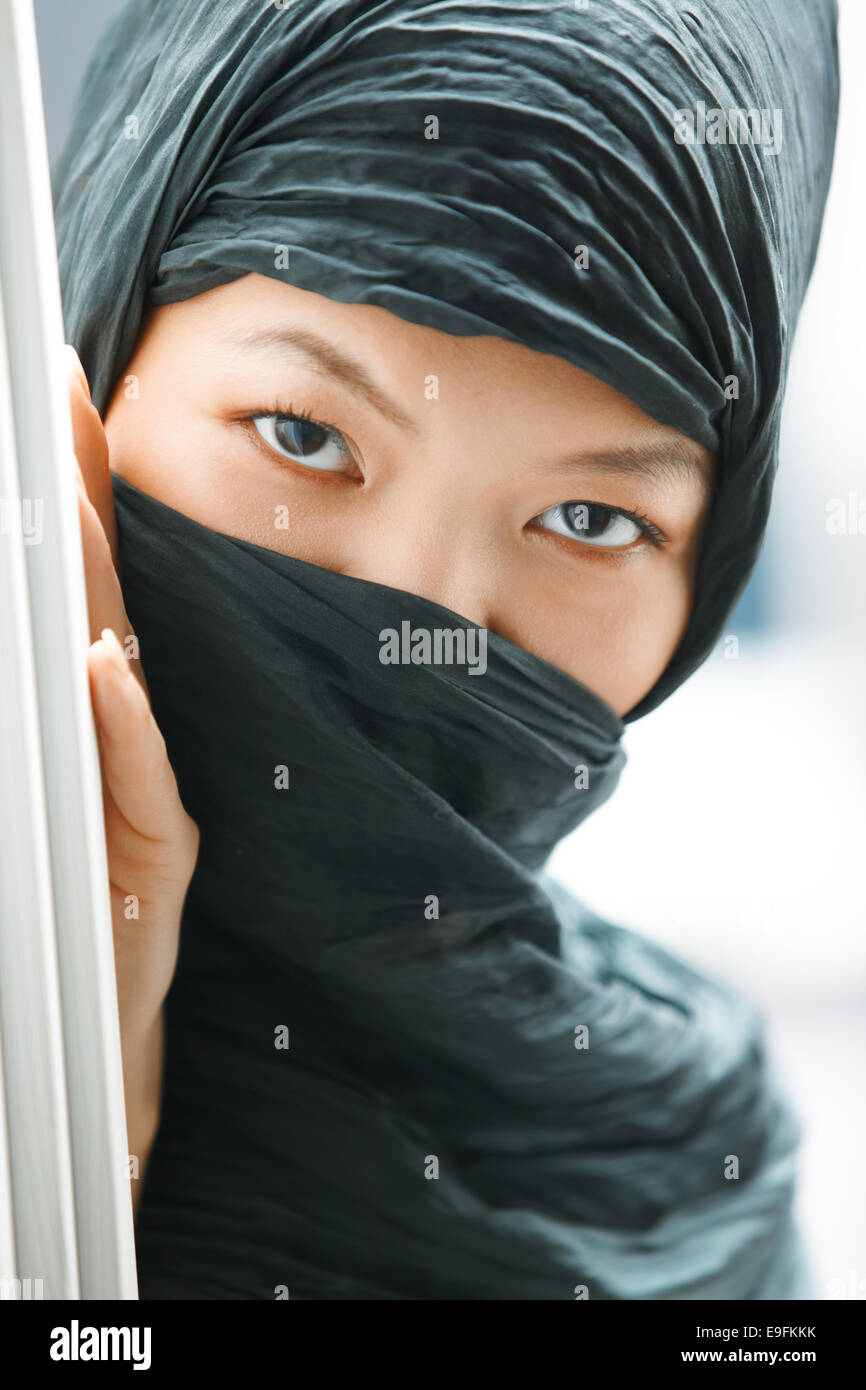 Lady hiding hi-res stock photography and images - Alamy