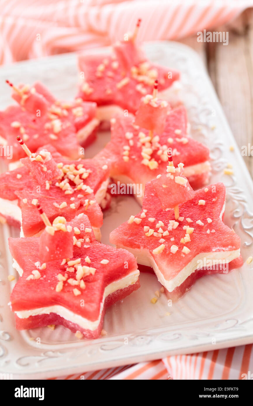 Star shaped watermelon sandwiches with soft cheese and nuts Stock Photo ...
