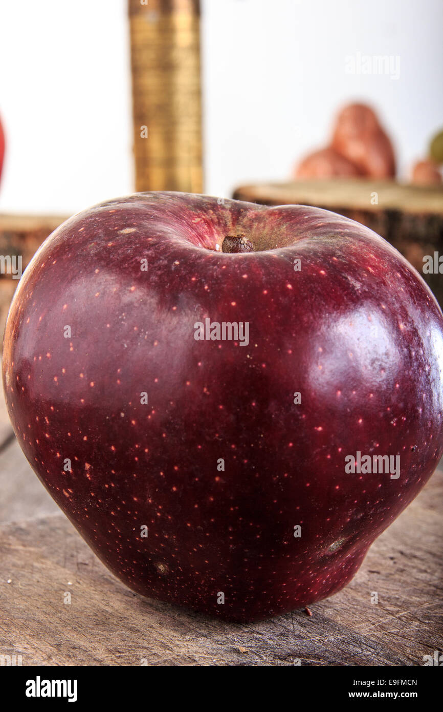 Really red apple on gray old wooden table, retro vintage style Stock ...