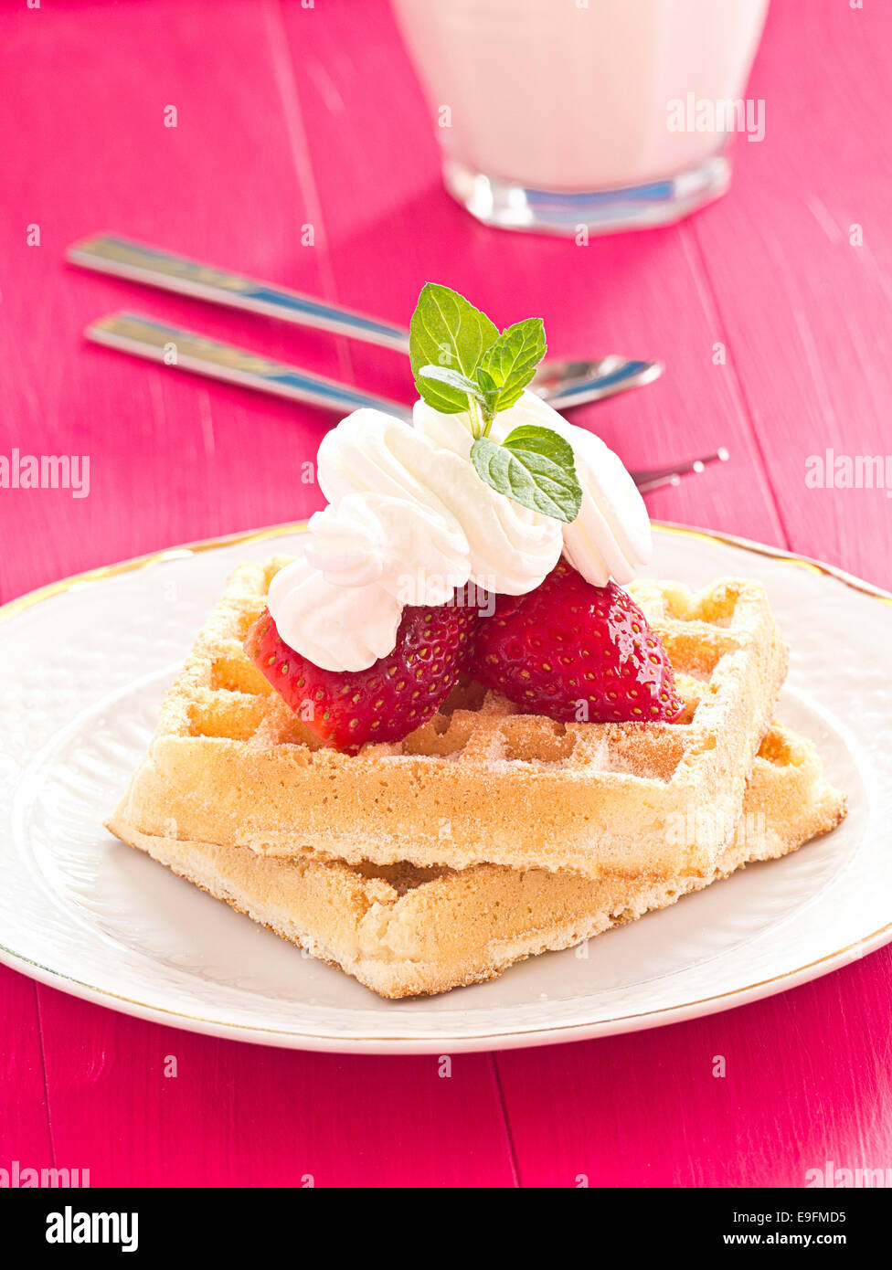 Waffles with strawberries and whipped cre Stock Photo - Alamy