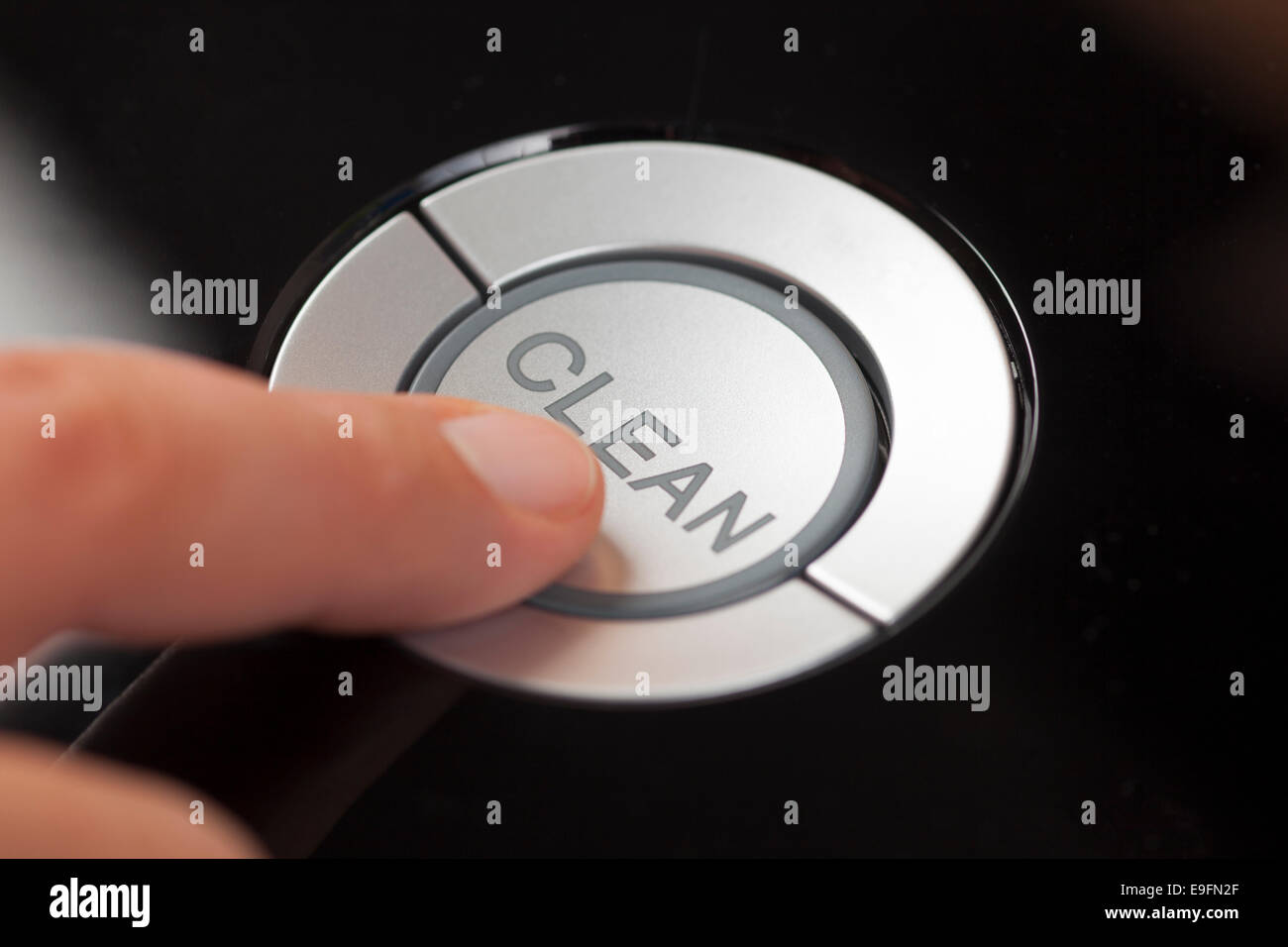 Woman's finger pressing the button "Clean Stock Photo - Alamy